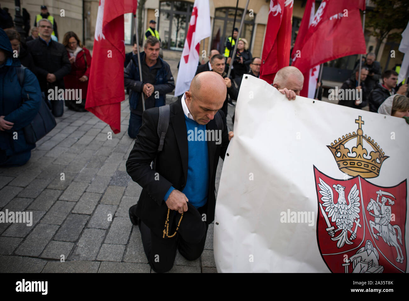 Participants of the National Rosary March seen kneeling and praying ...
