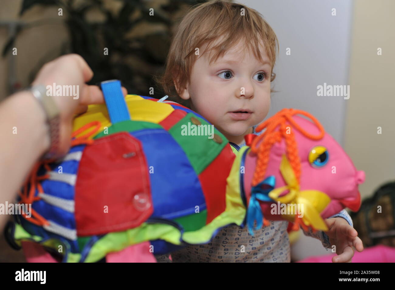 Little todler baby girl having fun indoor the room Stock Photo - Alamy