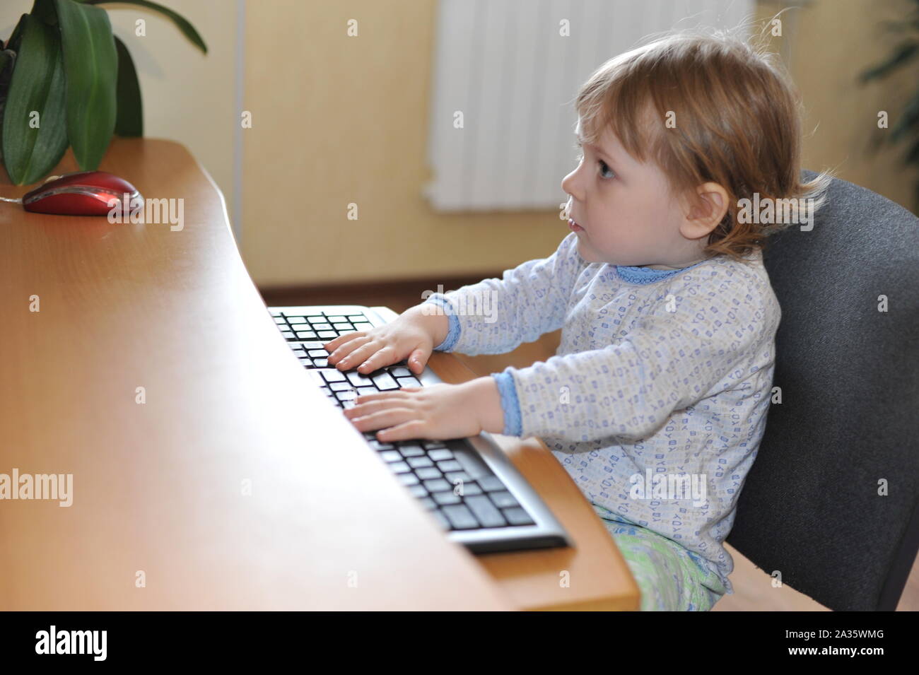 Portrait cheerful baby boy typing hi-res stock photography and images ...