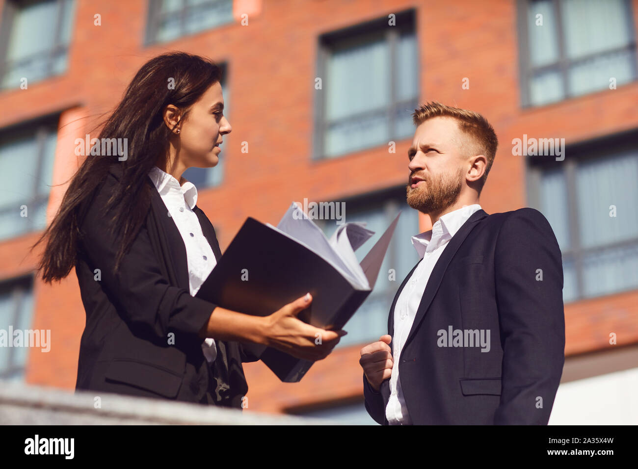 Business people discuss documents hi-res stock photography and images ...