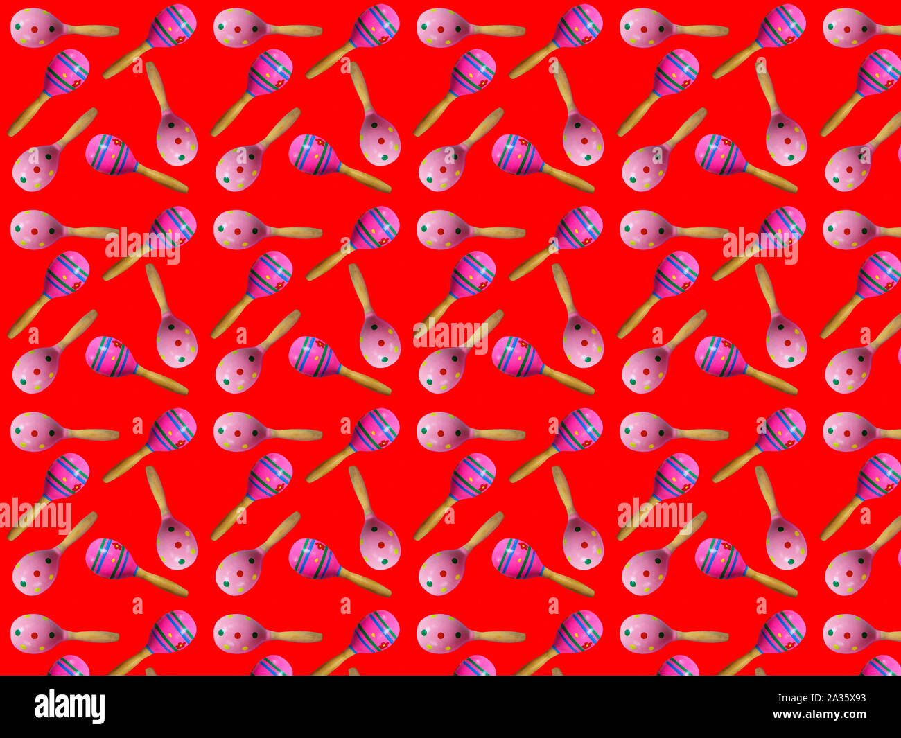 Seamless patern rattle (toy) for a child on a red background ...