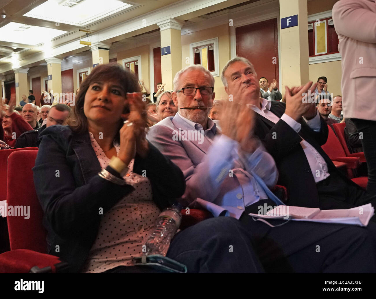Labour leader Jeremy Corbyn (centre) with his wife Laura Alvarez (left ...