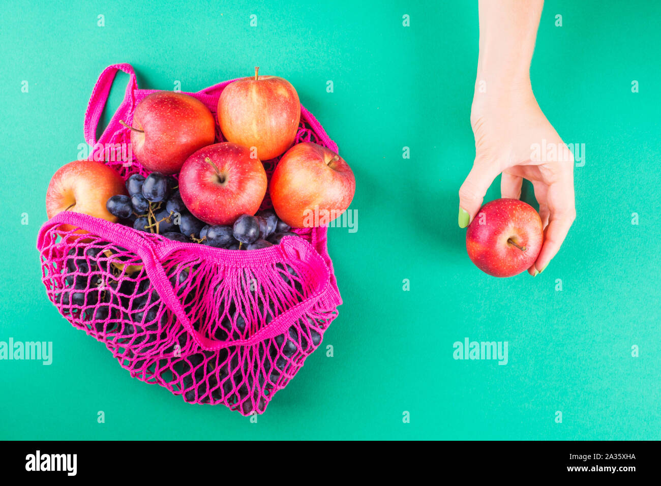 Zero waste concept. Reusable mesh shopping bag full of fresh produce ...