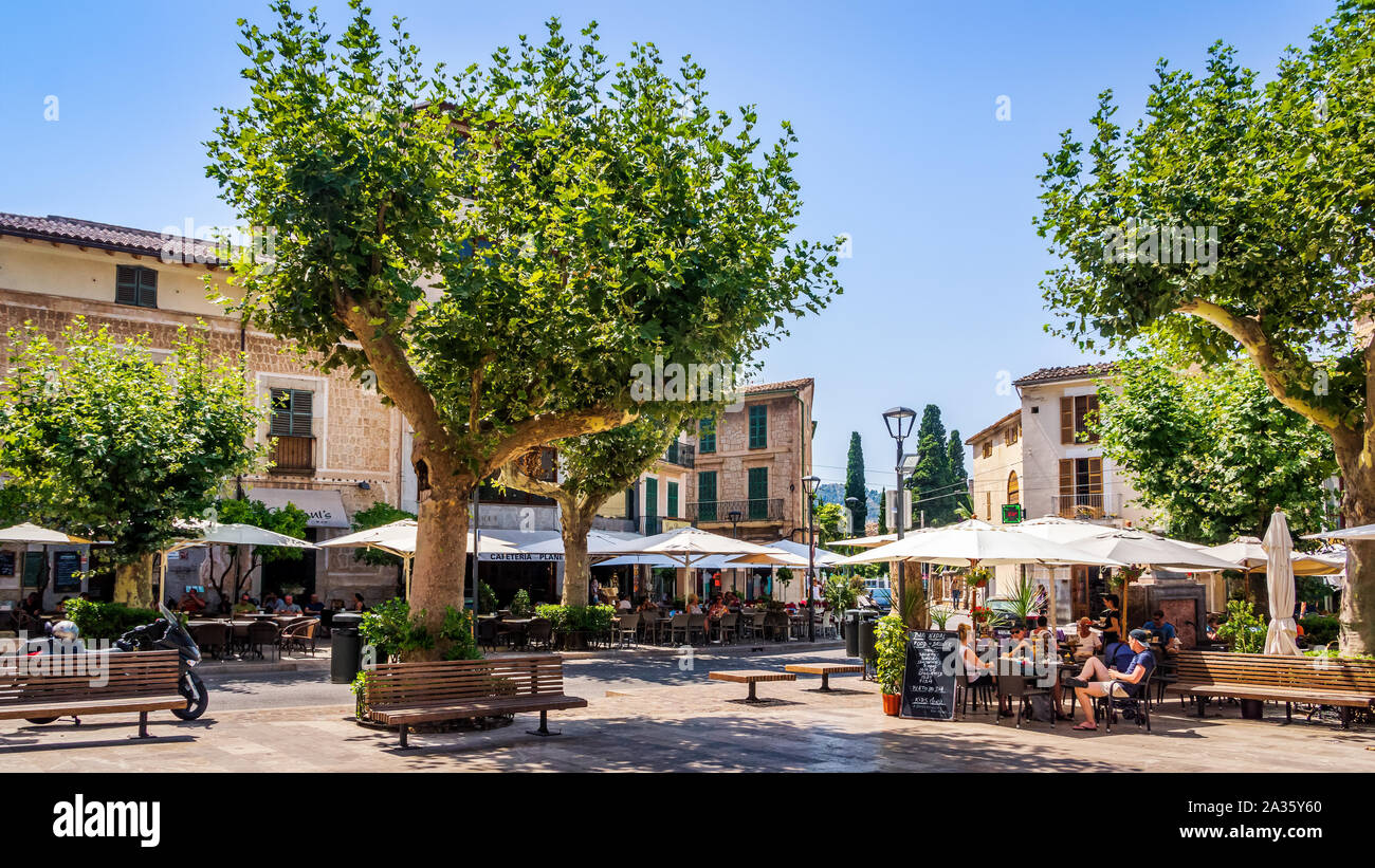 Soller, Mallorca, Spain, July 2015 Main city square with trees, beer ...