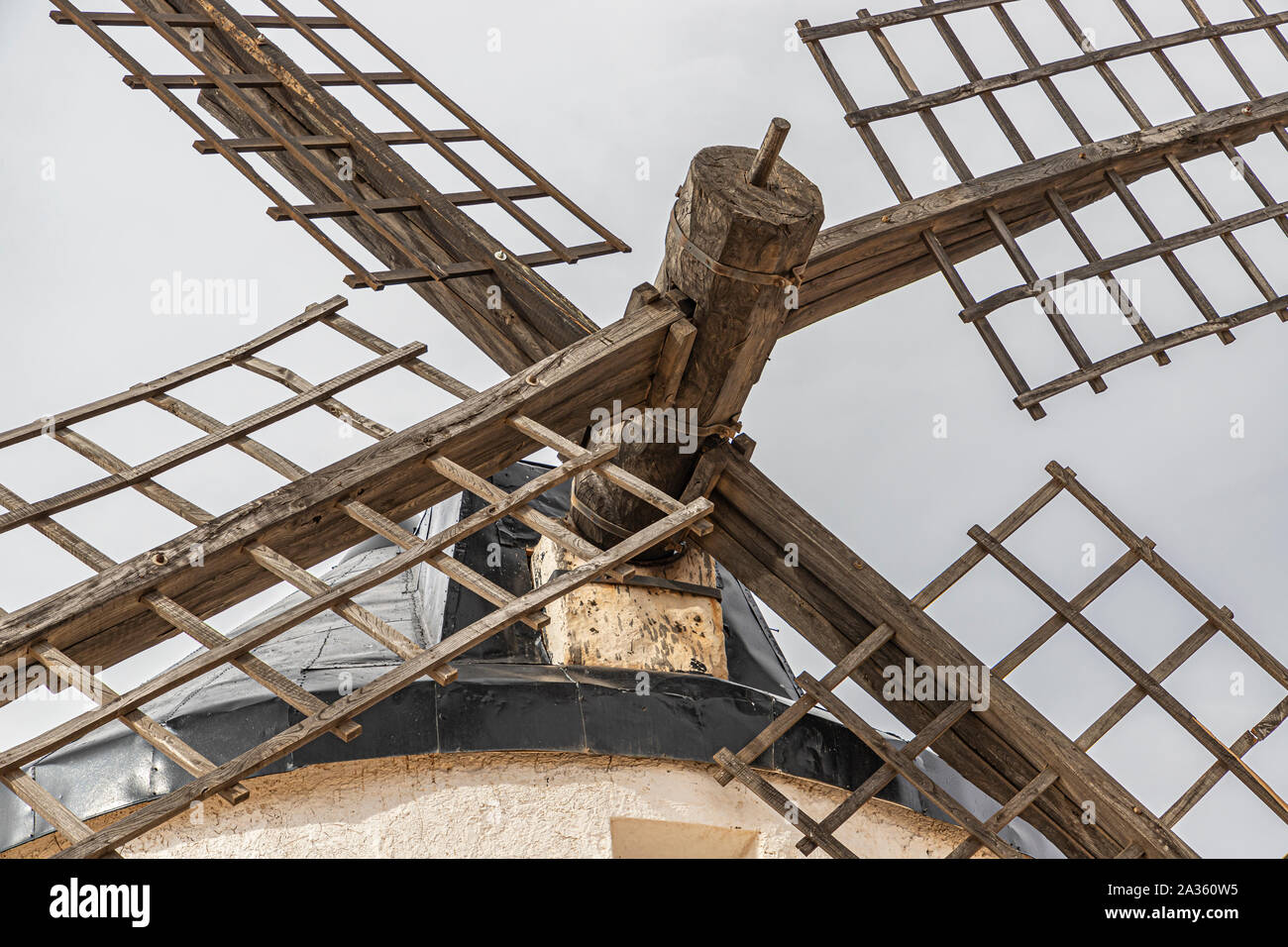 closeup in horizontal view of the rotor and wooden blades of an old ...