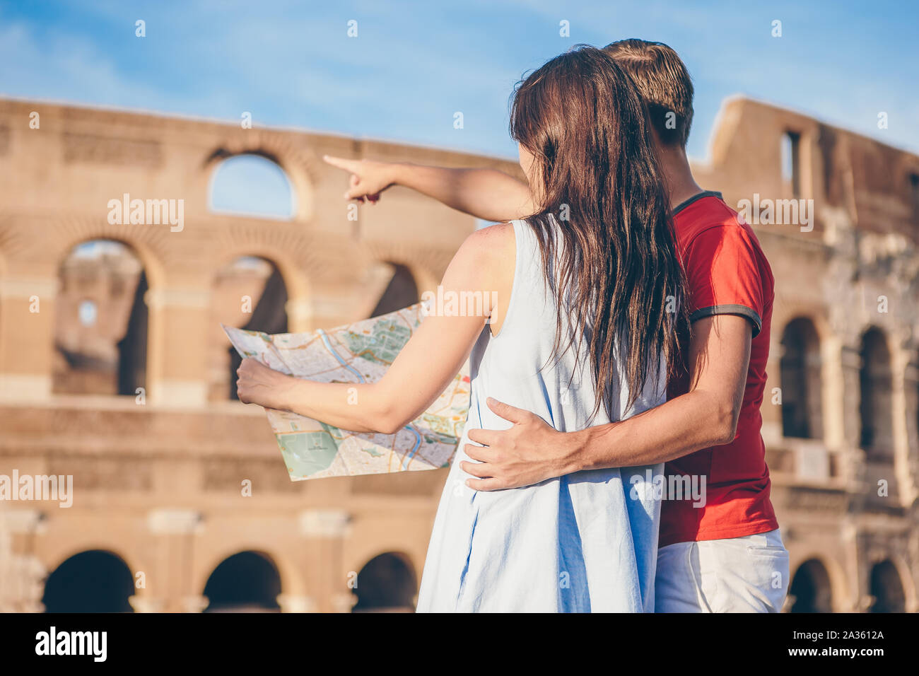 Happy family in Europe. Romantic couple in Rome over Coliseum ...