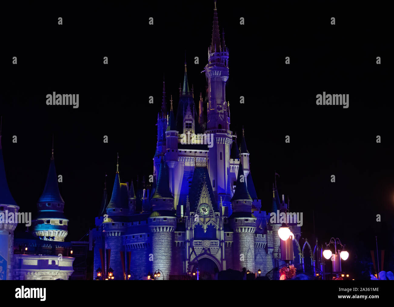 Night colour projections on Cinderella Castle at Disney Stock Photo - Alamy