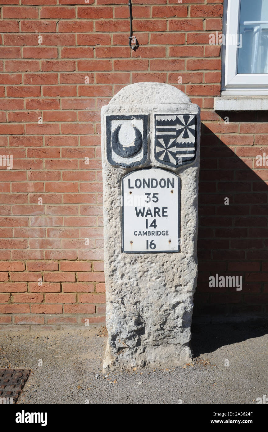 Milestone, Barkway, Hertfordshire, bearing the crescent arms of Trinity ...