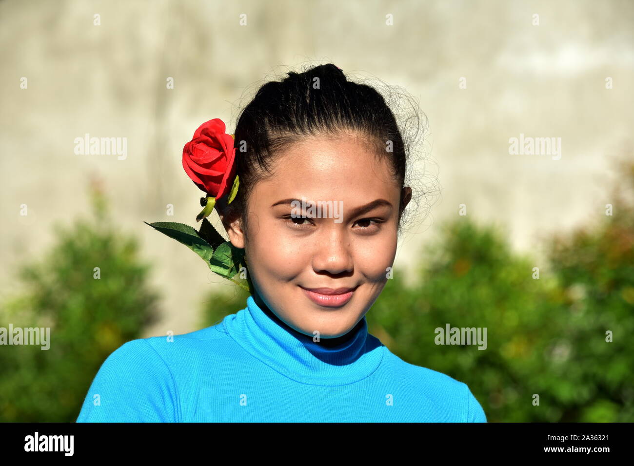 Female with flower hi-res stock photography and images - Alamy