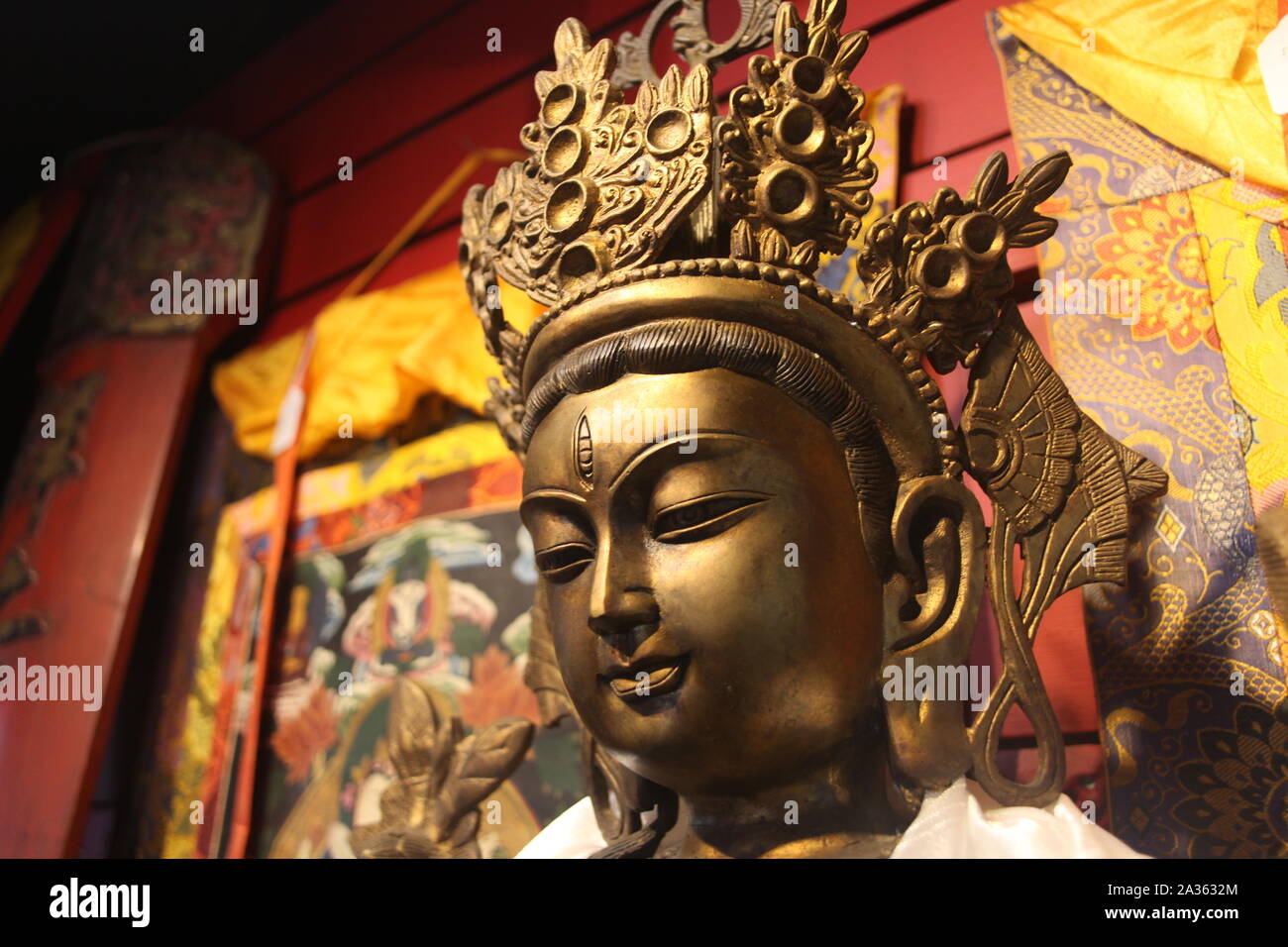 Golden coloured statue of Buddha Stock Photo - Alamy