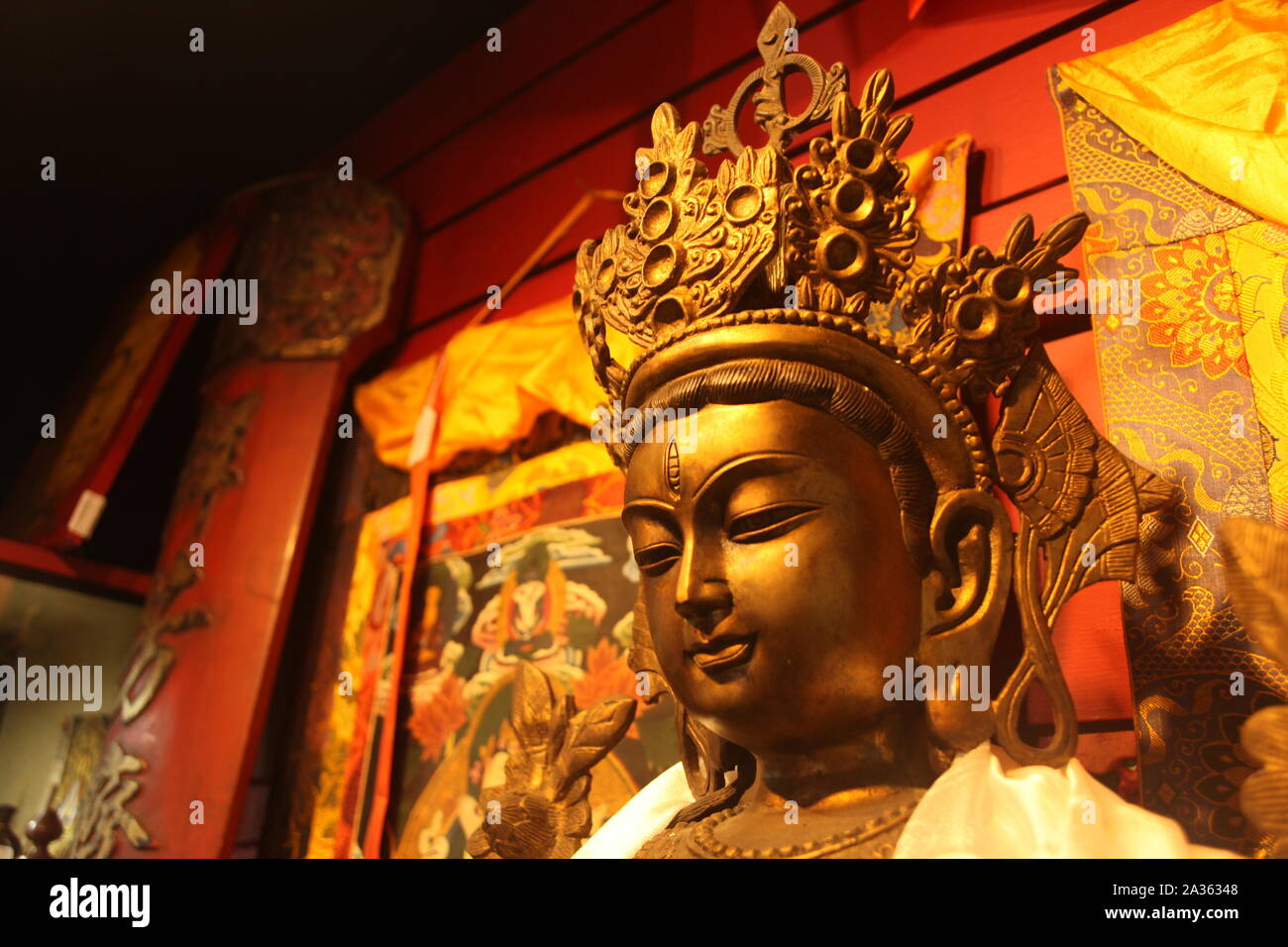 Golden coloured statue of Buddha Stock Photo - Alamy