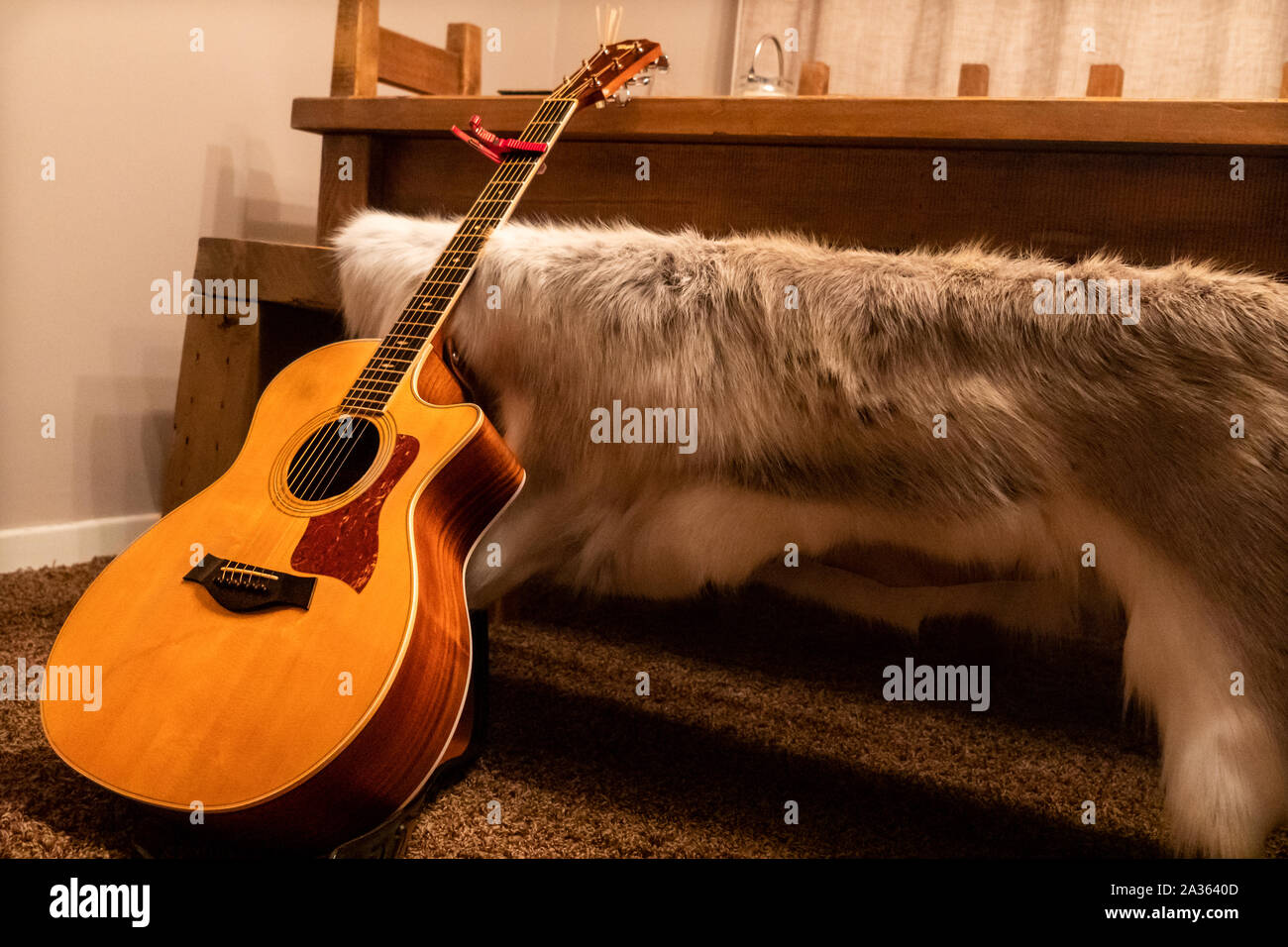 Acoustic guitar leaning on home made table Stock Photo - Alamy