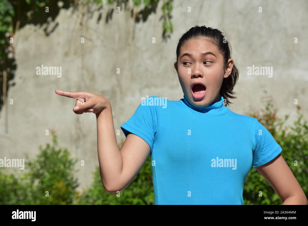 A Filipina Adult Female Pointing Stock Photo - Alamy