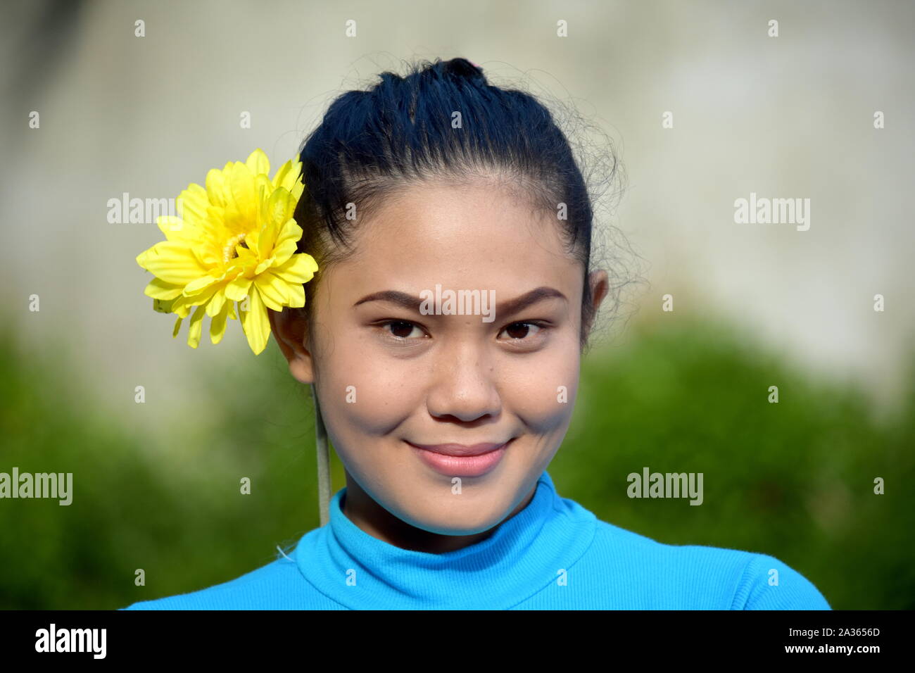 Portrait Of A Female Woman With A Daisy Stock Photo - Alamy