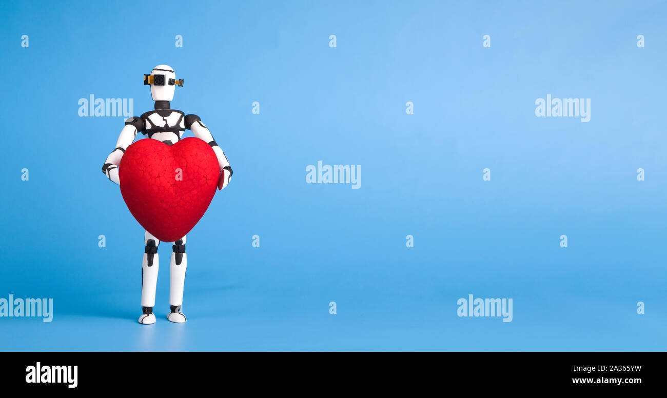 Cute robot holding red heart, blue panorama background Stock Photo - Alamy