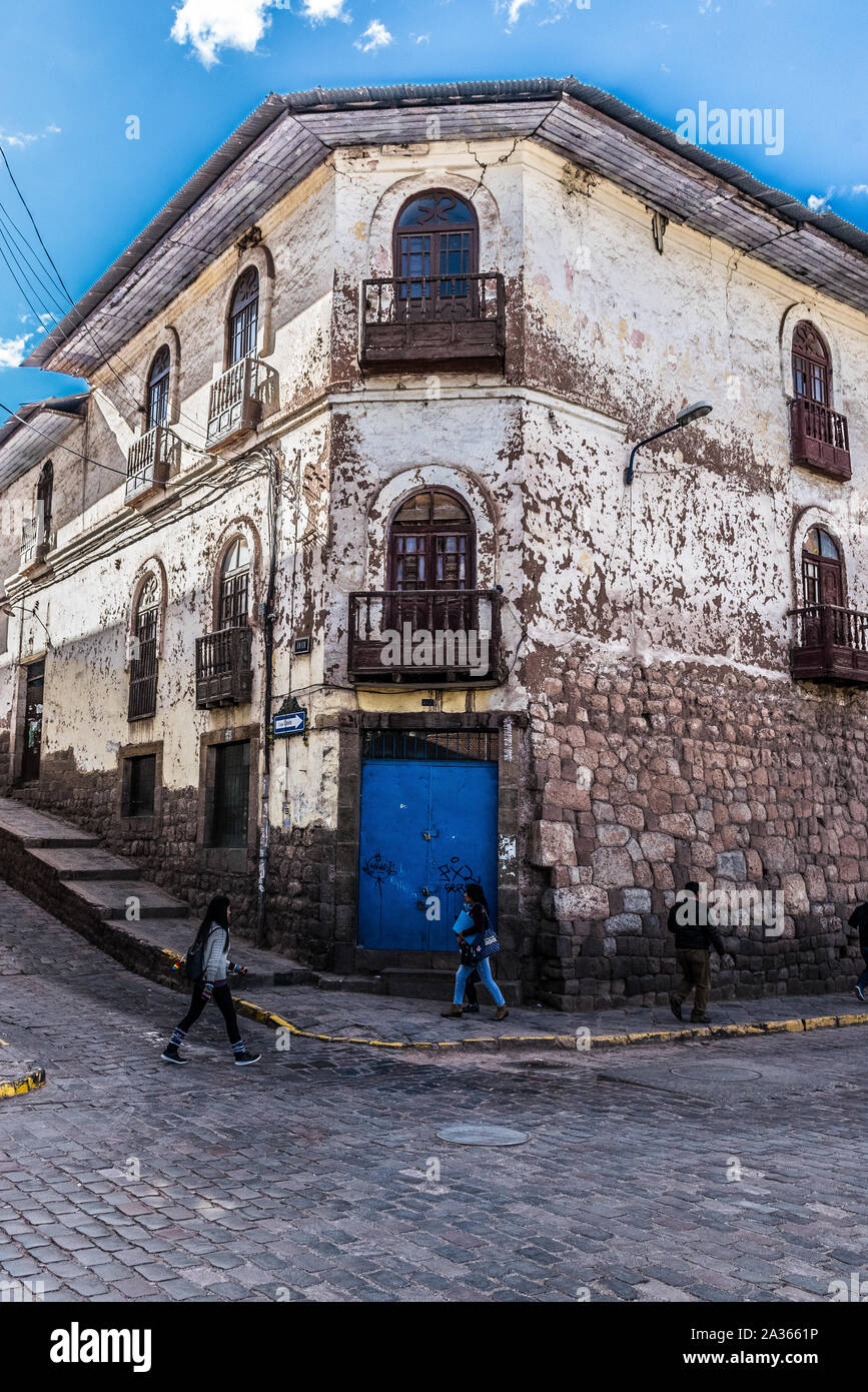 Cusco, Peru - 05/24/2019: Bright blue door and wood carved balconies in ...