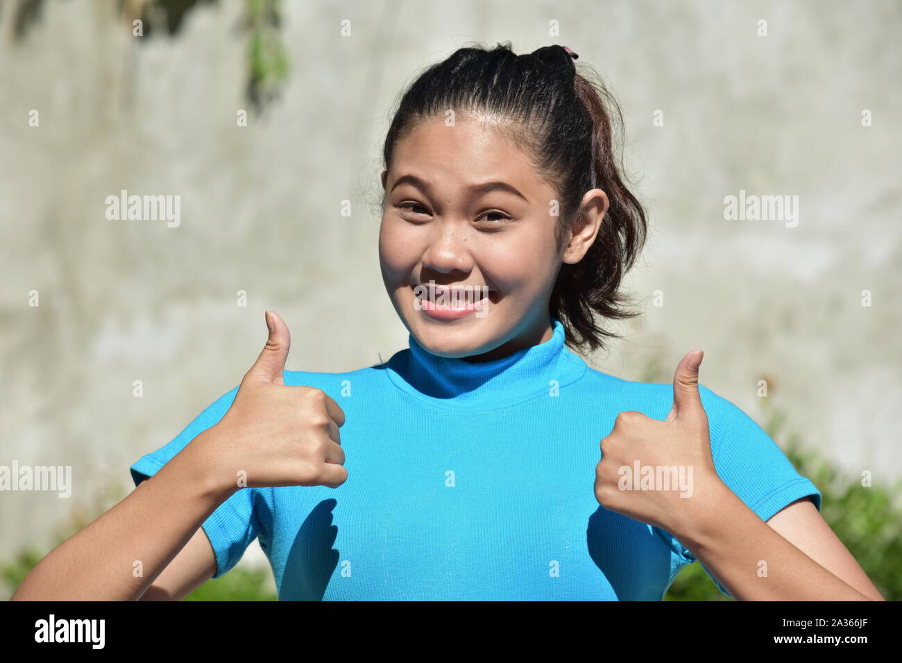 A Beautiful Female With Thumbs Up Stock Photo - Alamy