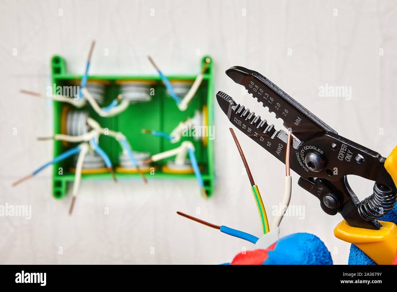 Installation of home wiring. The bare ends of copper electric wires ...