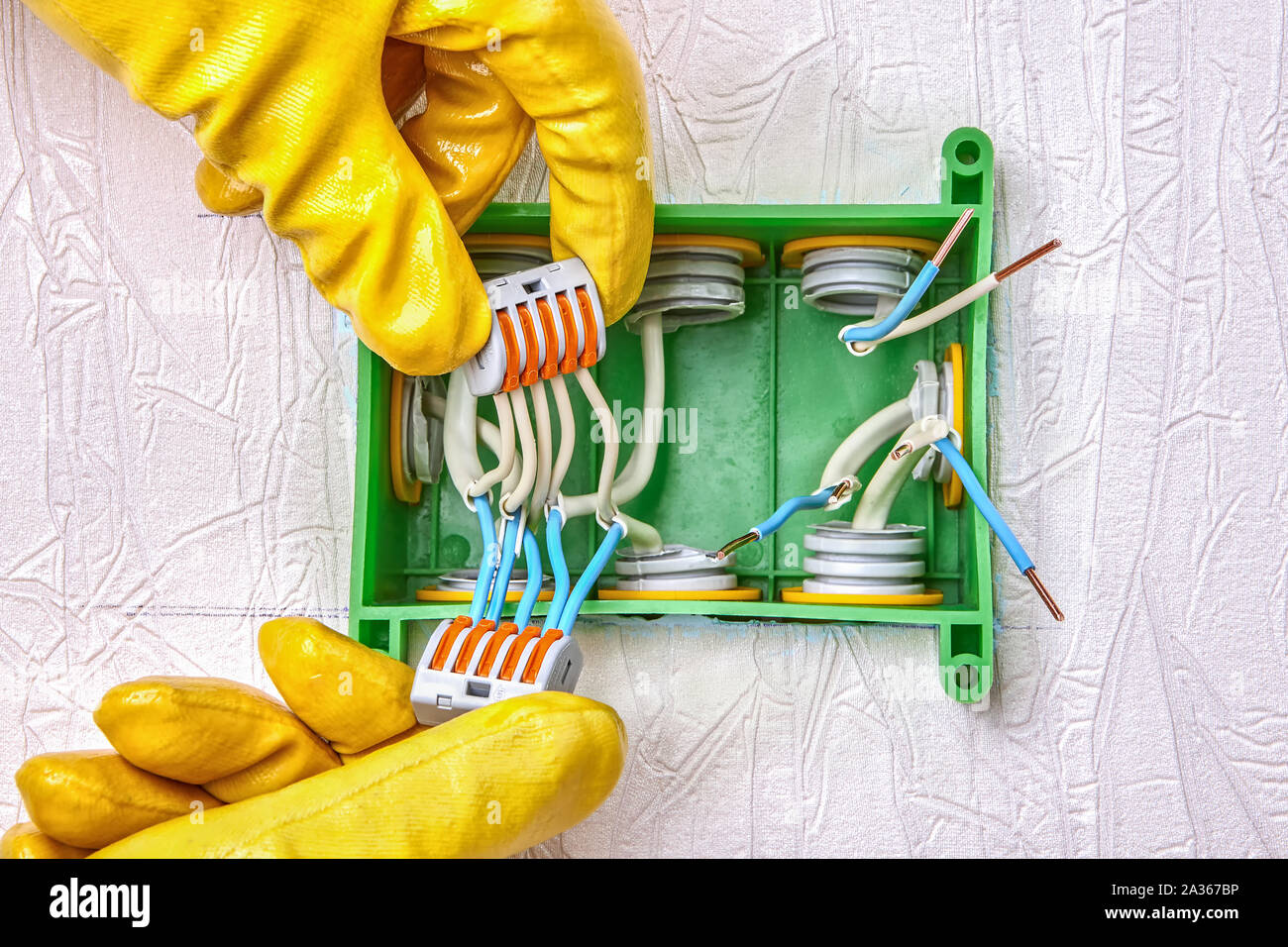 Electrical installation work, junction box mounting. Use of splicing ...