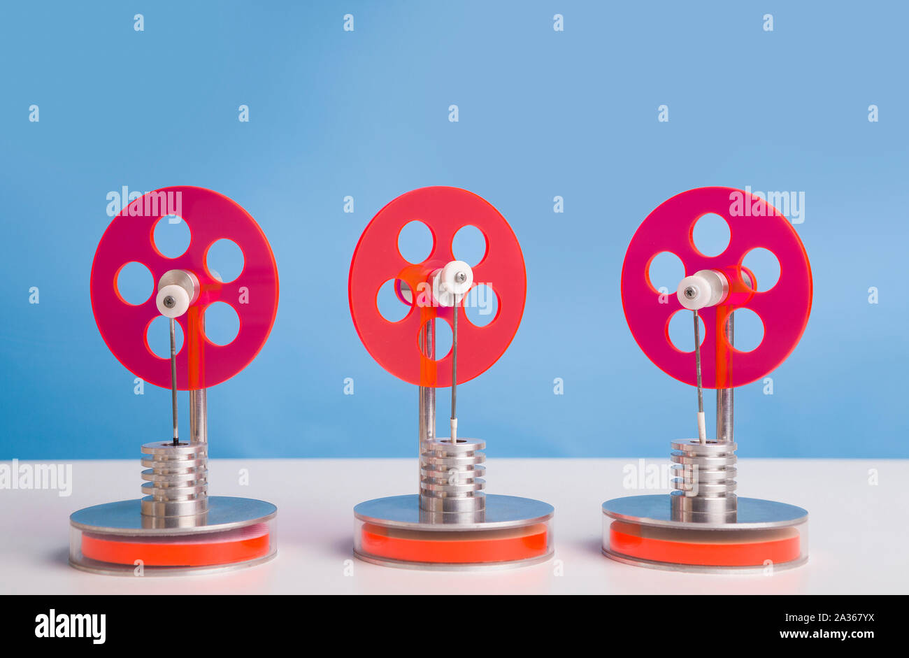 Handmade power engines with red gears on blue background Stock Photo ...