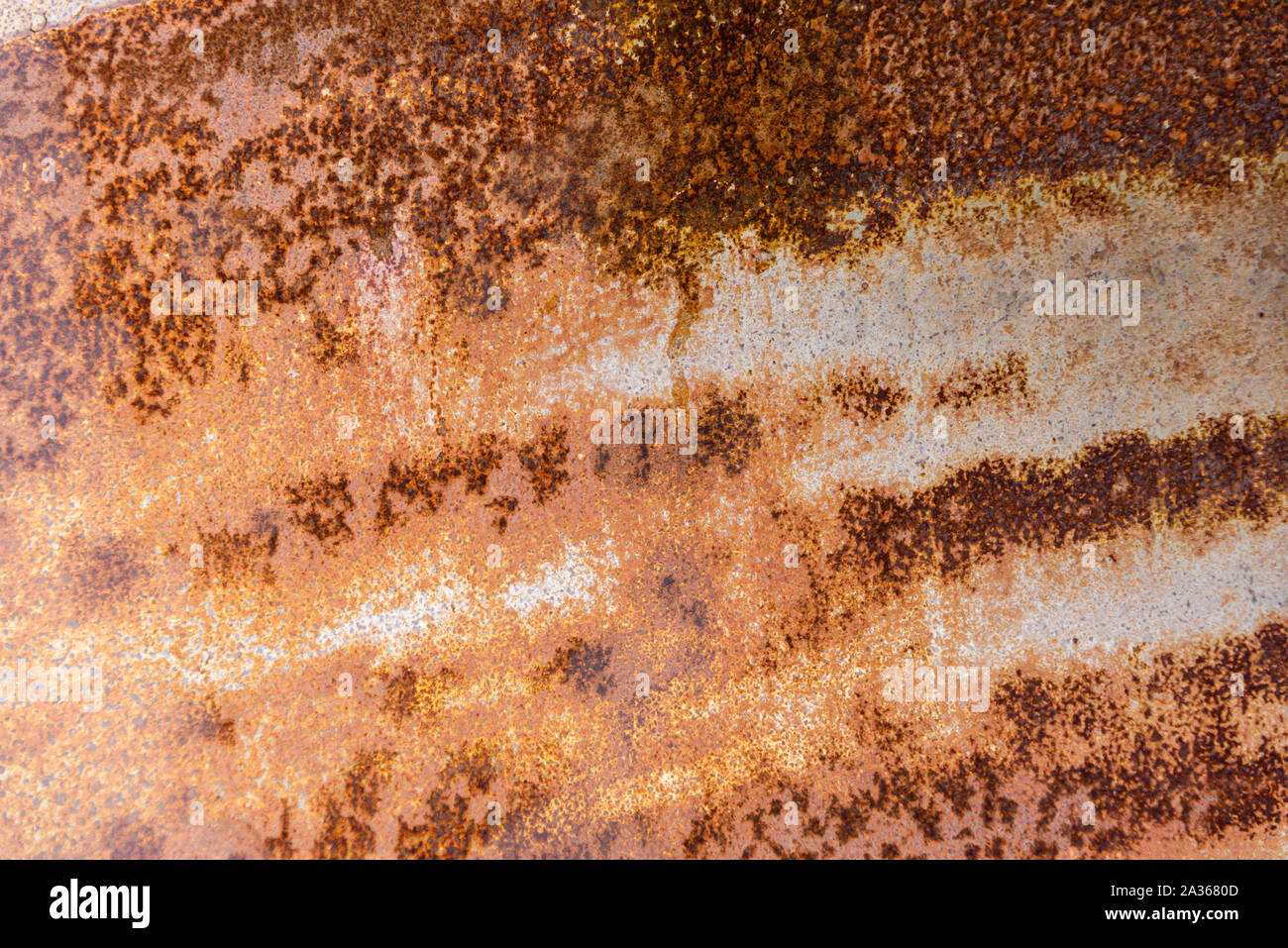 The old, dirty and corroded metal plate with rusty surface, close up ...