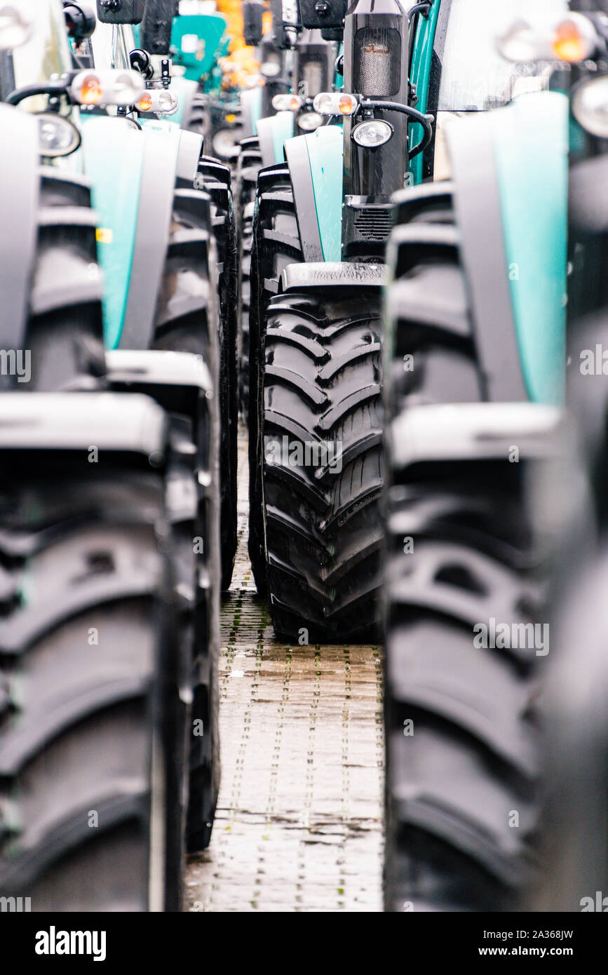 Agriculture machine detail in rainy day. Tractor close up of black, wet ...