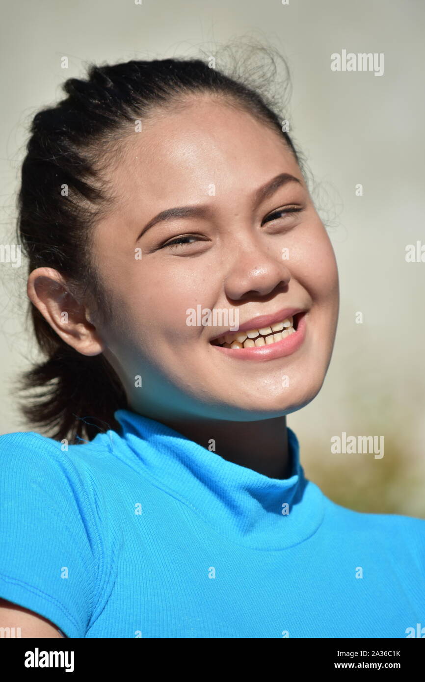 A Young Minority Female Smiling Stock Photo - Alamy