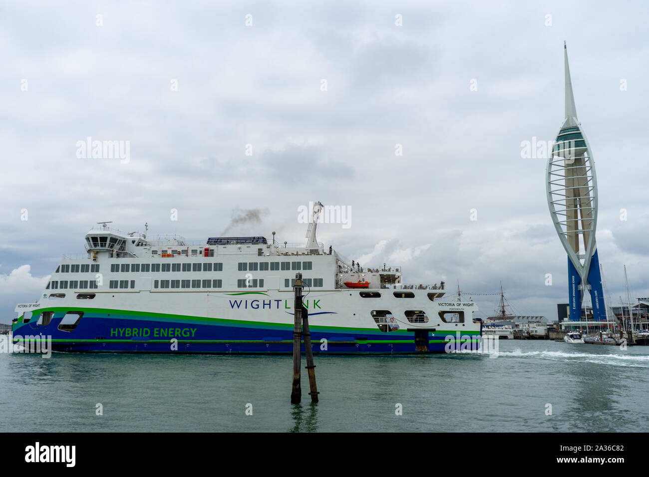 A Wightlink Hybrid ferry passing the spinnaker tower and Gunwharf quays in Portsmouth Stock ...