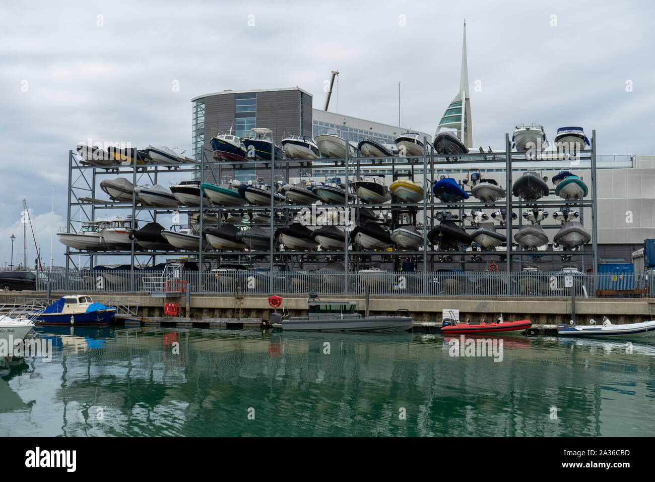 A boat stack filled with boats for storage Stock Photo - Alamy