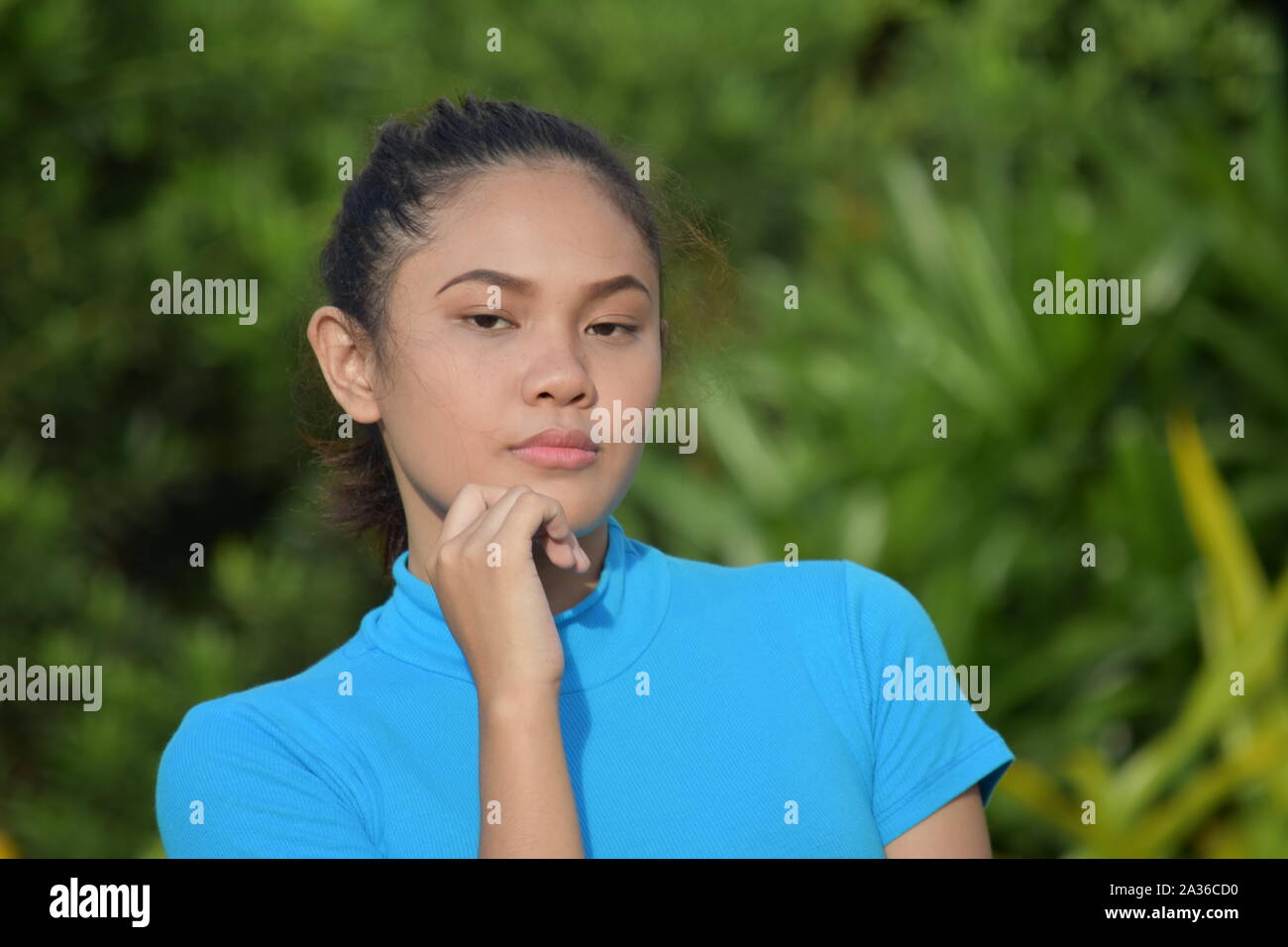 An Asian Adult Female Thinking Stock Photo - Alamy