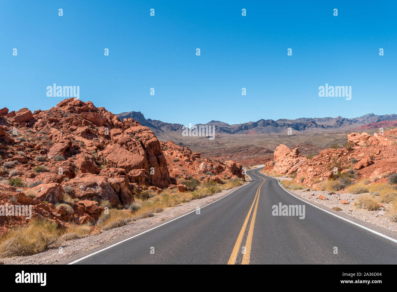 Two Way Highway Crossing Large Red Sandstones Rocks with Clear Skies ...