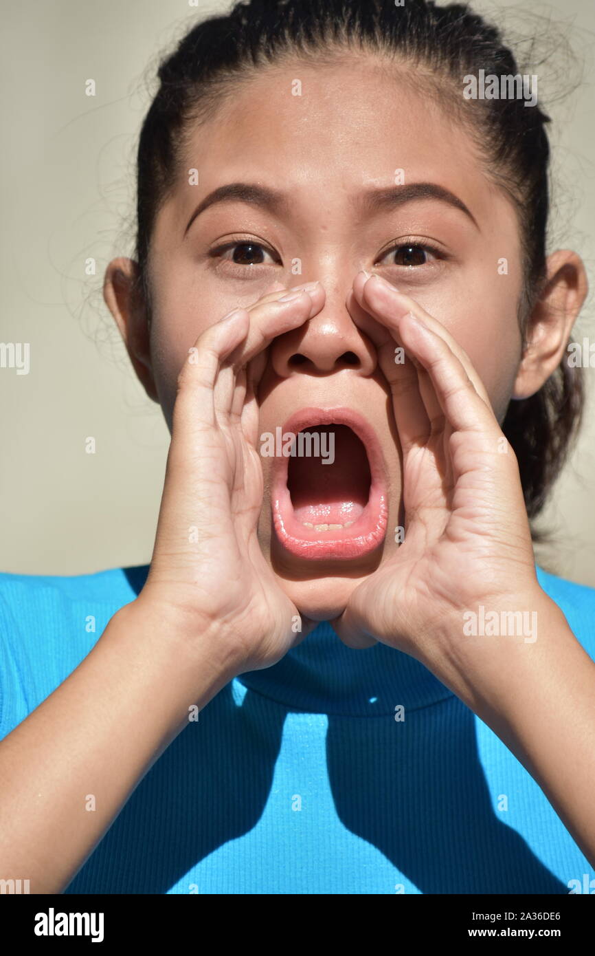 A Youthful Asian Adult Female Shouting Stock Photo - Alamy