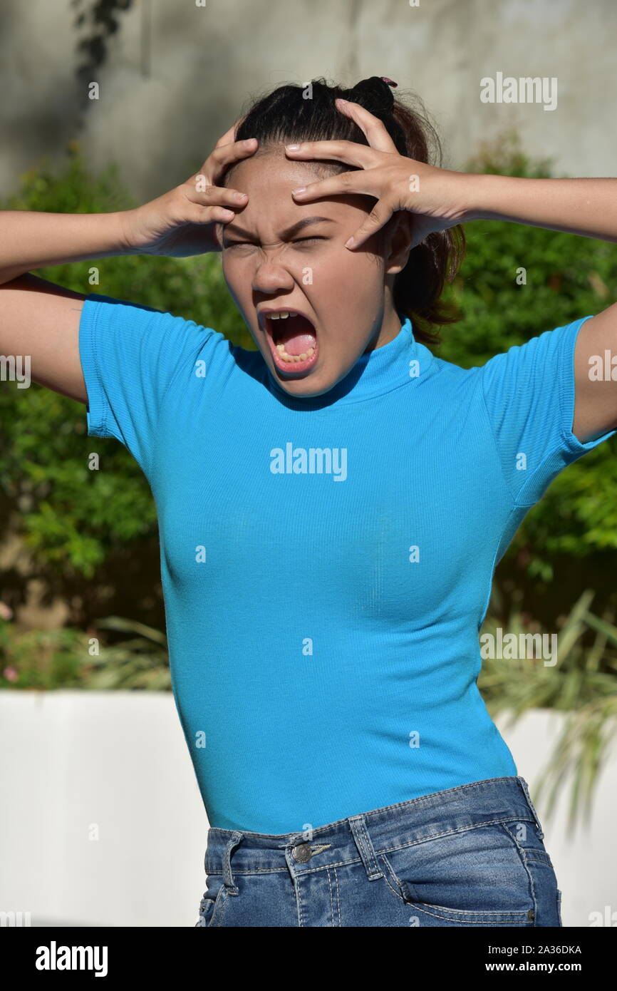 A Stressed Youthful Asian Person Stock Photo - Alamy