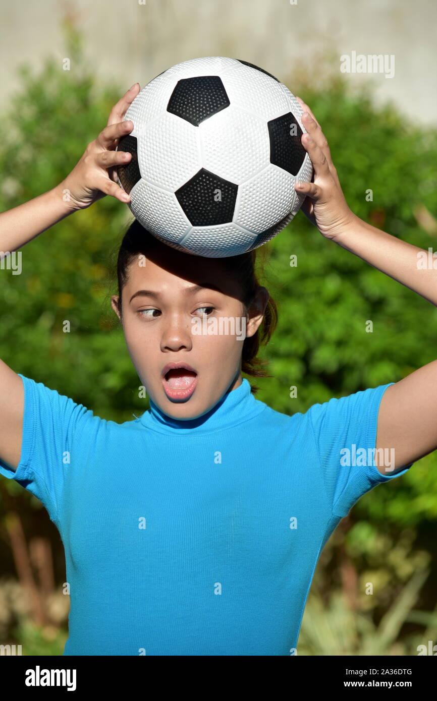 Surprised Sporty Asian Female Soccer Player With Soccer Ball Stock ...
