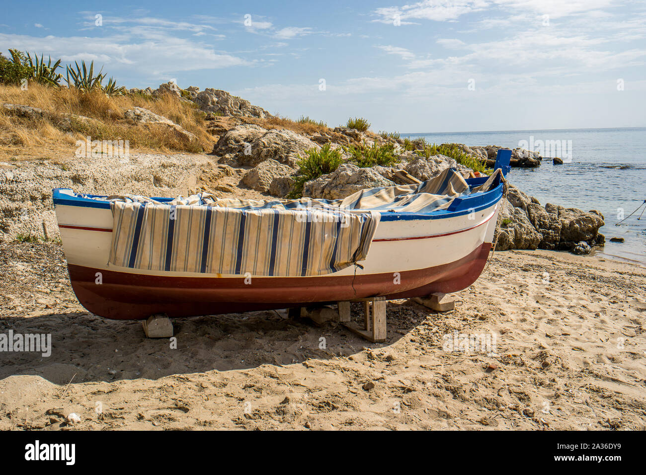 lonely boat on the beach Stock Photo - Alamy