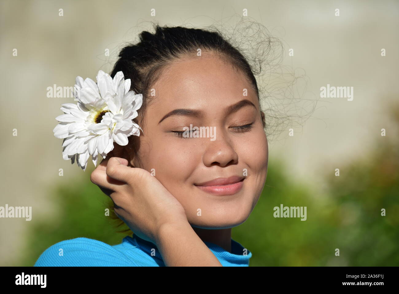 Happy young woman flowers hi-res stock photography and images - Alamy