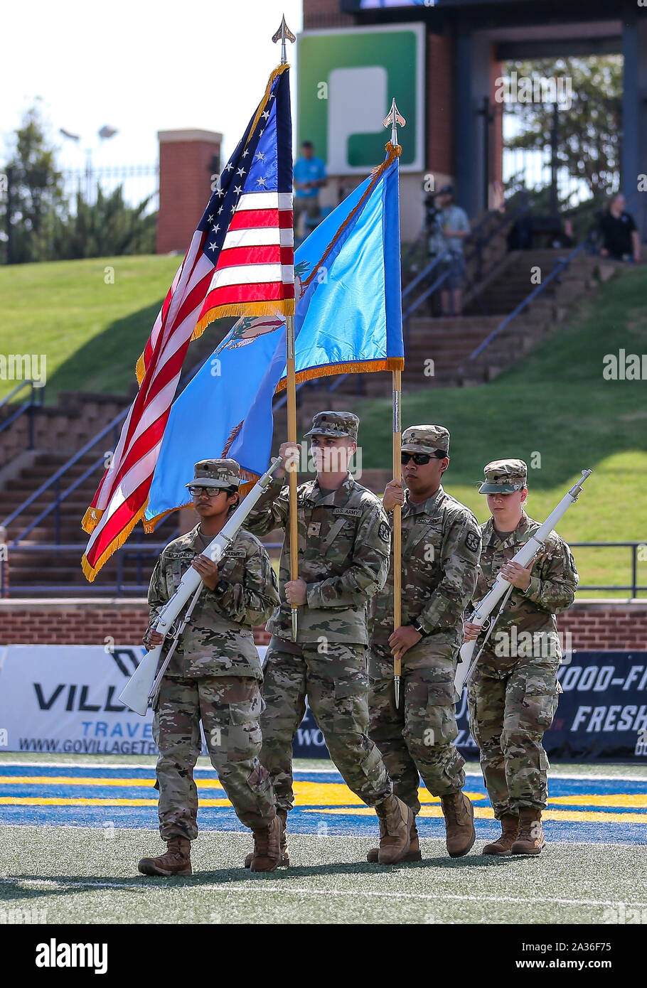 Edmond, OK, USA. 05th Oct, 2019. An ROTC corps marches with the flags ...