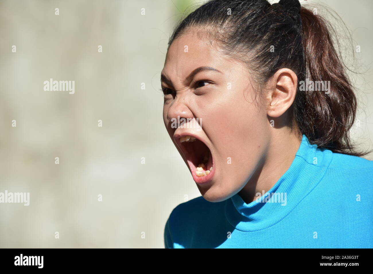 An Attractive Adult Female Yelling Stock Photo - Alamy
