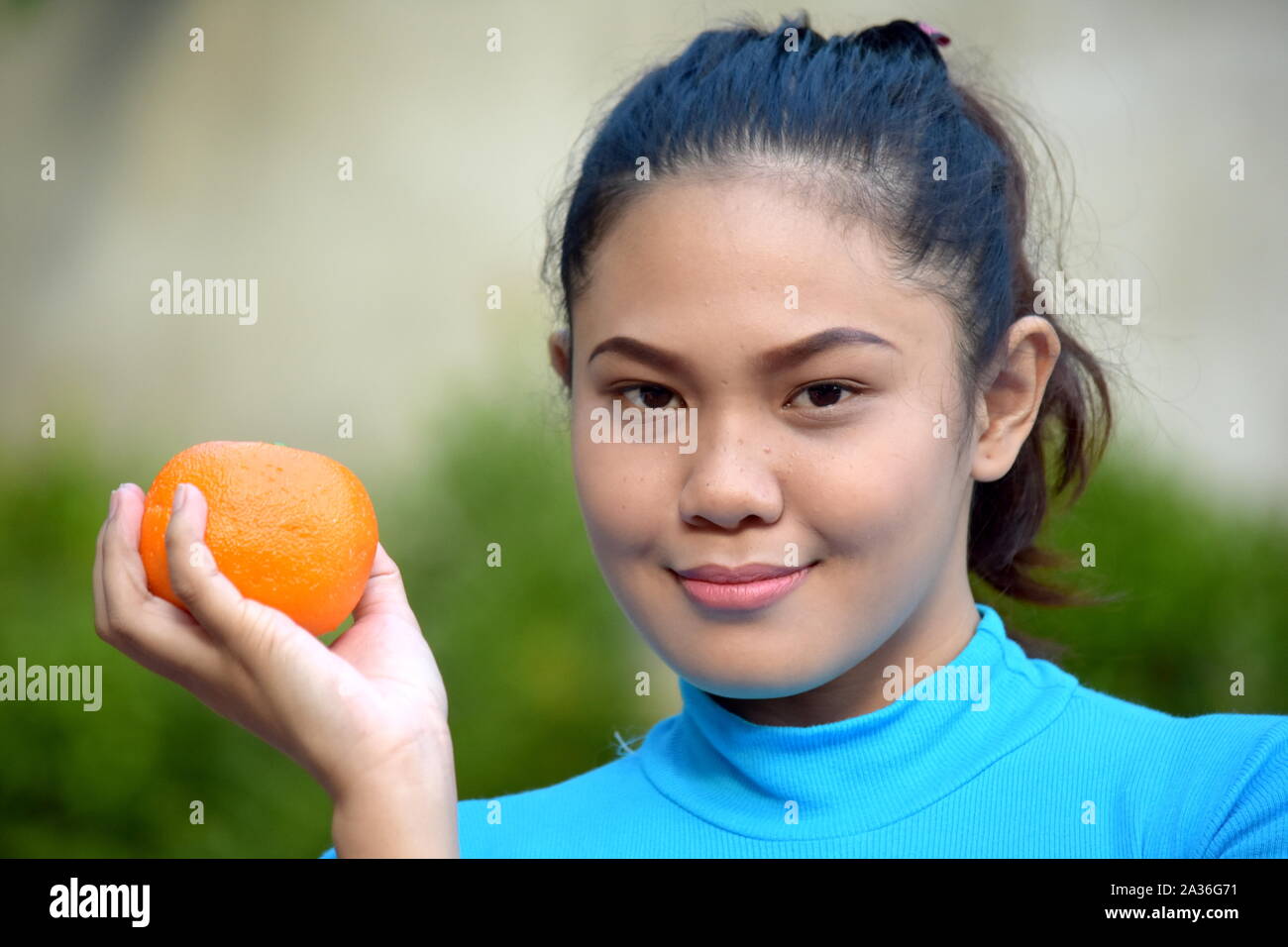 Beautiful young lady happy orange hi-res stock photography and images ...