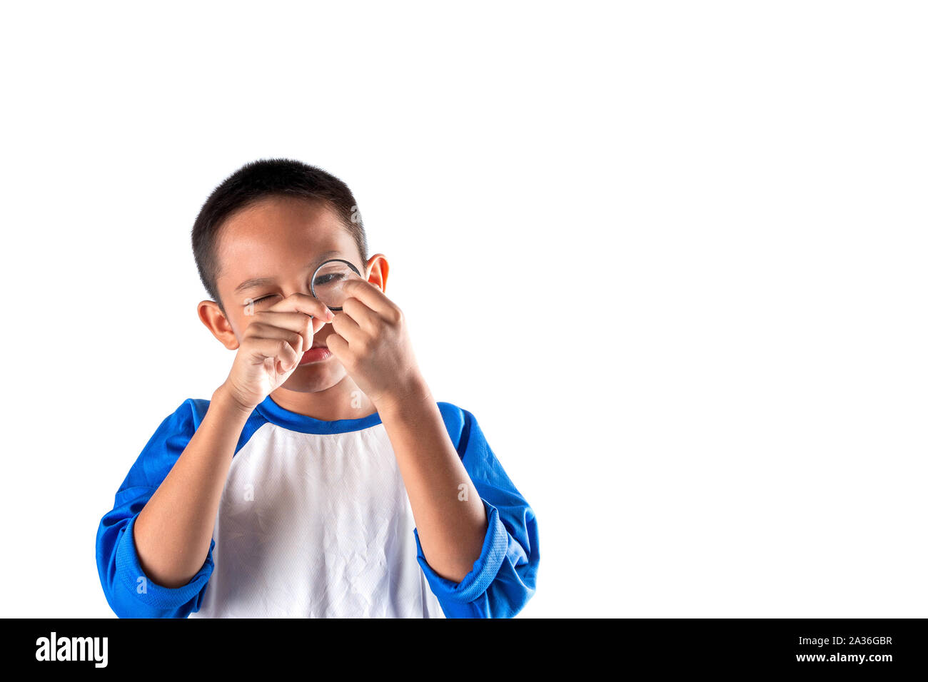The boy discovering something through a magnifying glass, Business ...