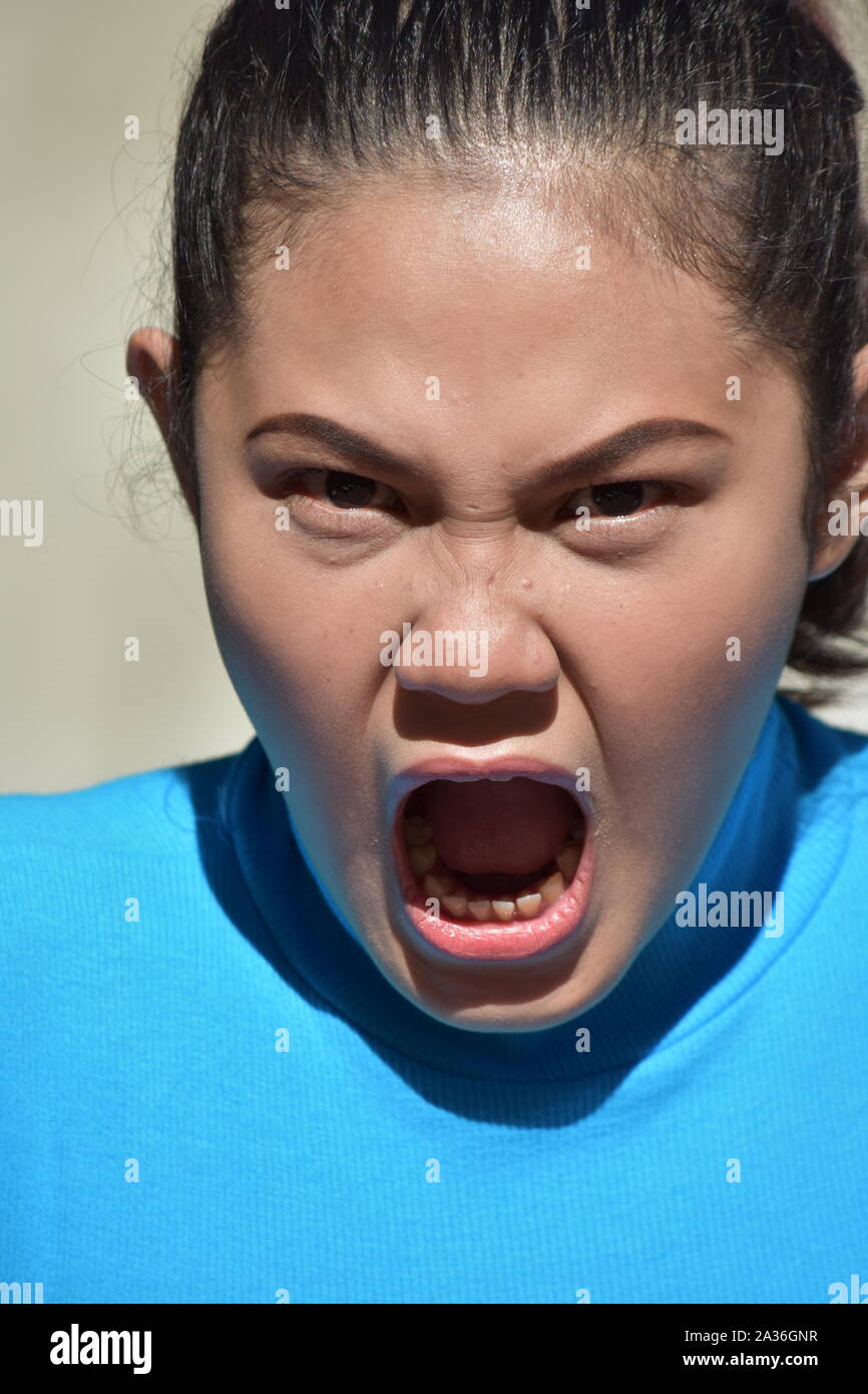 A Youthful Filipina Woman And Anxiety Stock Photo - Alamy