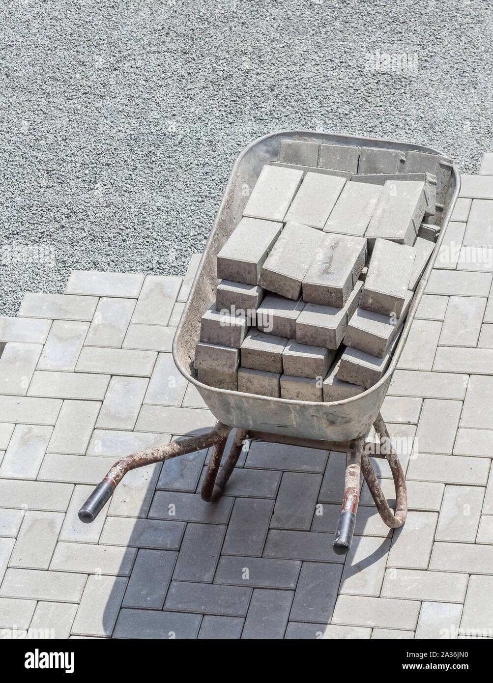 Push barrow with stones Road construction Stock Photo - Alamy