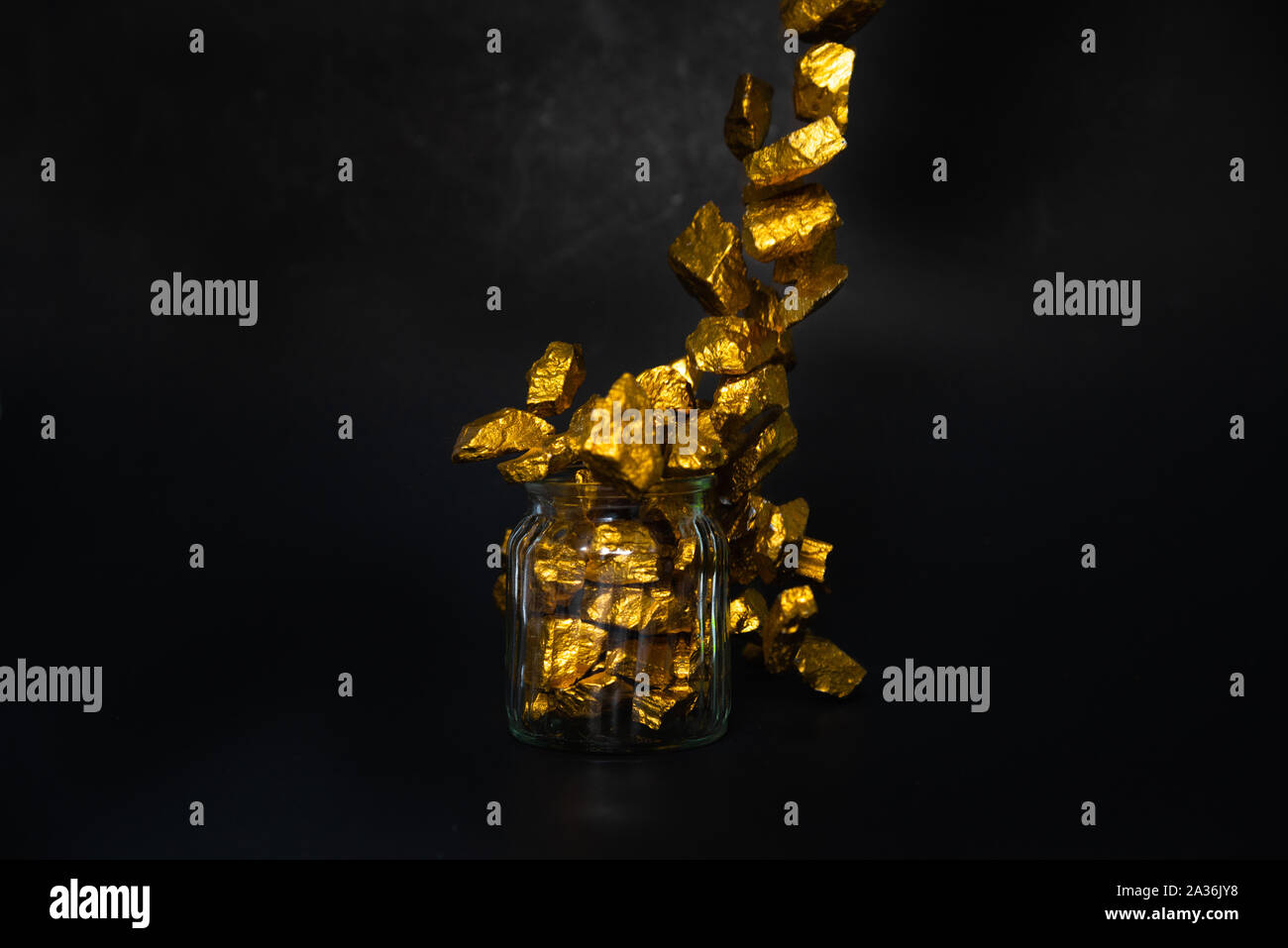 Falling gold nuggets, gold ore , precious stone or lump of golden stone ...