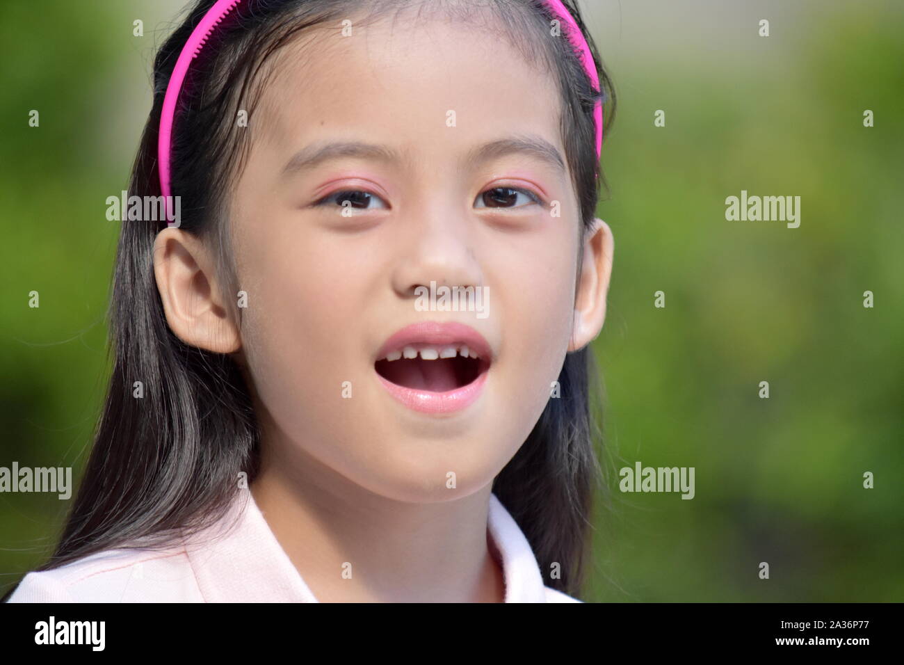 A Beautiful Asian Girl Child Talking Stock Photo - Alamy