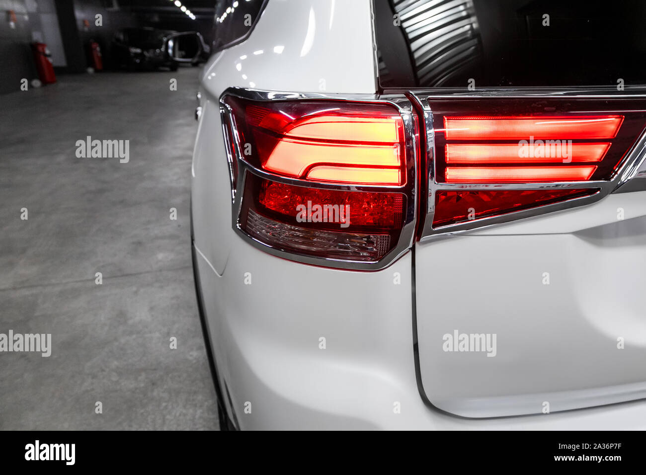 Back view of new white city crossover. Closeup headlights of car SUV ...