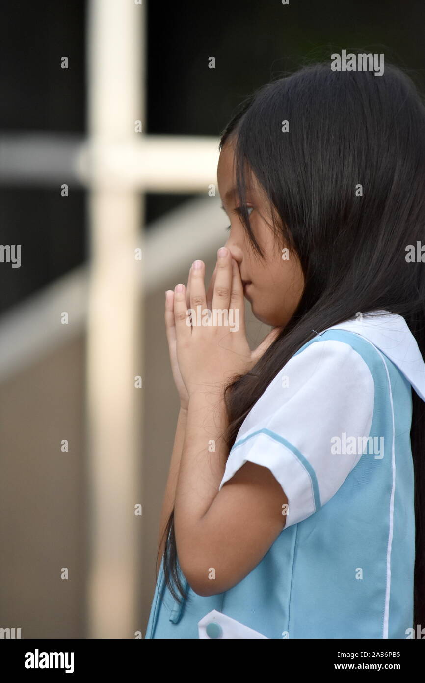 Child praying cross hi-res stock photography and images - Alamy