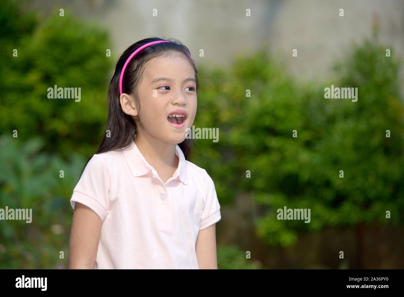 A Young Asian Juvenile Talking Stock Photo - Alamy
