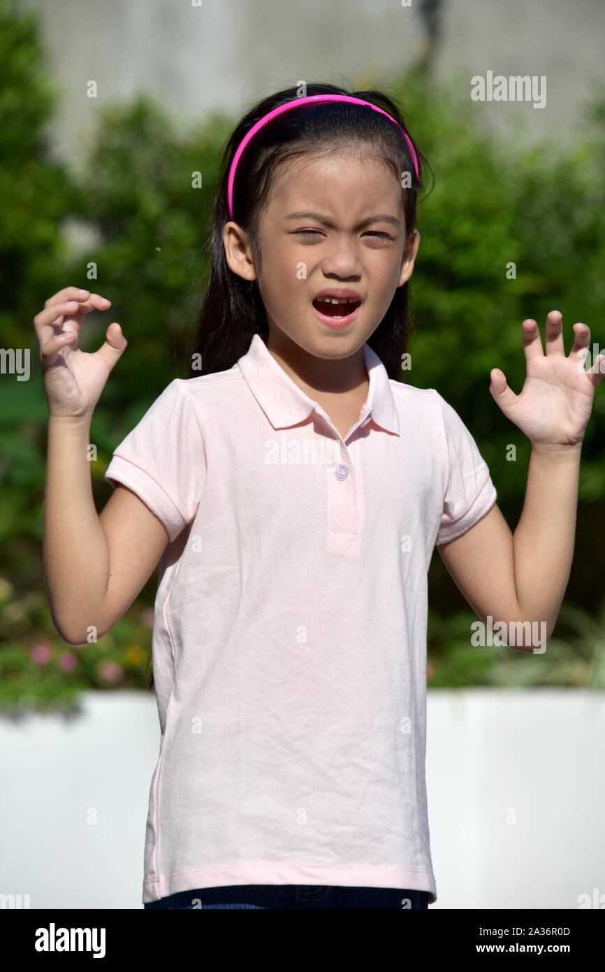 A Pretty Asian Girl And Fear Stock Photo - Alamy