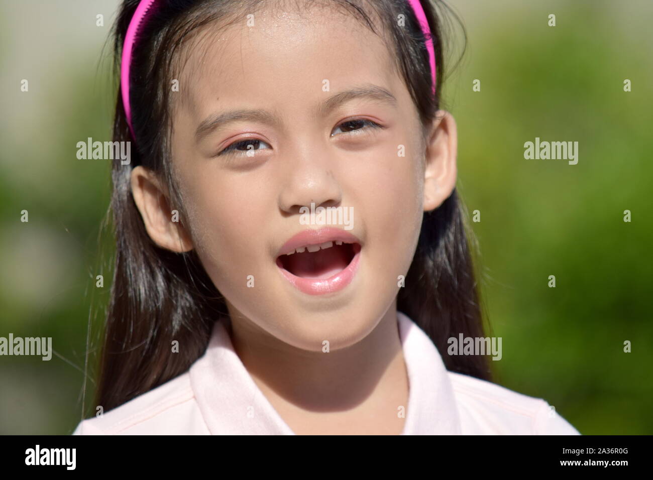 A Stressed Cute Filipina Girl Stock Photo - Alamy