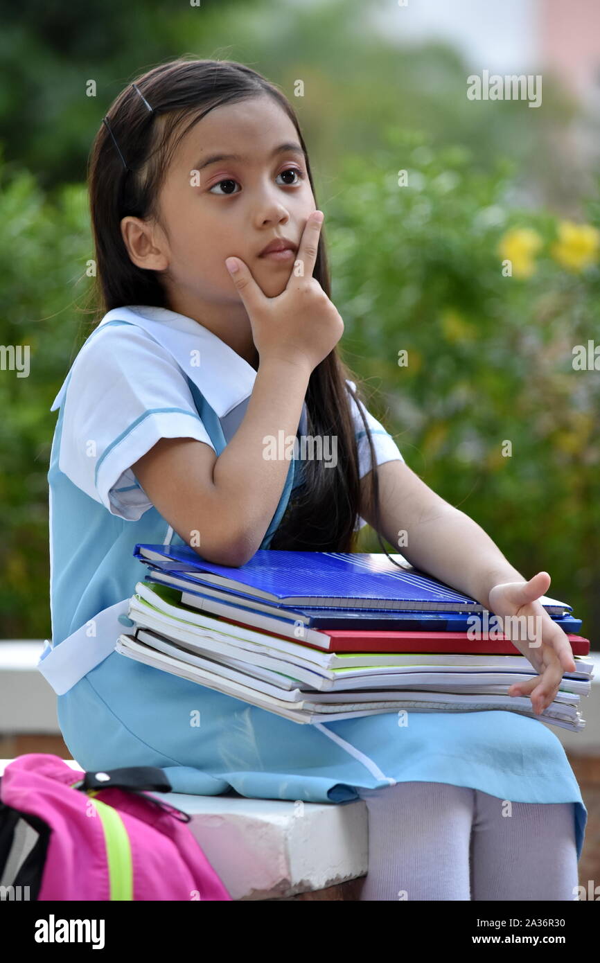 Cute Minority Child Girl Student Thinking Stock Photo - Alamy